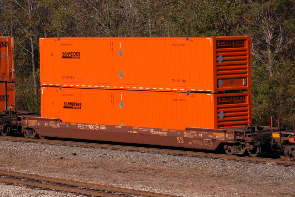 Florida East Coast Railway (FEC) stack car #71766 with Schneider National 53 foot containers ...